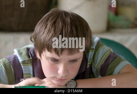 A boy hardly solving homework Stock Photo - Alamy