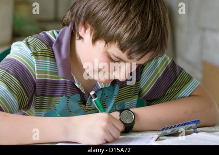 A boy hardly solving homework Stock Photo - Alamy
