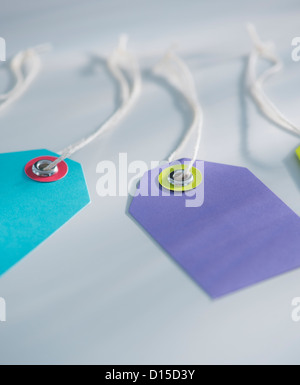 Close up of gift tags with strings Stock Photo - Alamy
