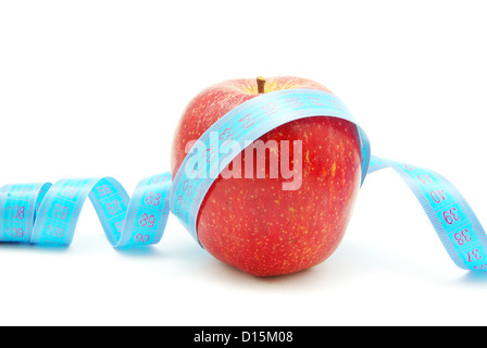 apple and measuring tape on a white background Stock Photo - Alamy