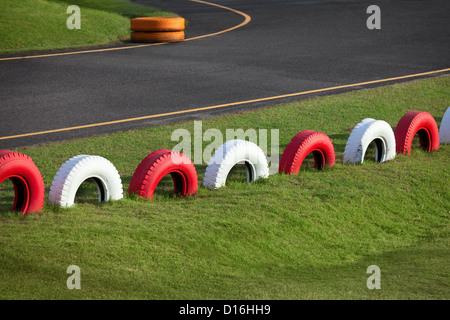 Racing track for karting with color wheels and grass Stock Photo - Alamy