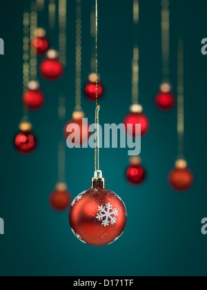 Decorative snow globes hanging on grey background Stock Photo - Alamy