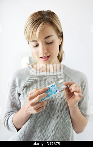 WOMAN TAKING GENERIC DRUG Stock Photo - Alamy