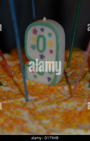 Birthday cake with candle number 0 - Orange background Stock Photo - Alamy