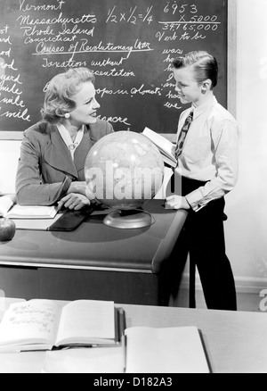 1960s TEACHER AT BLACKBOARD WITH MALE & FEMALE STUDENT EXPLAINING MATH ...