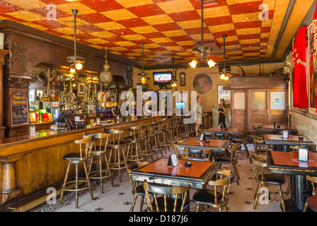 Inside a Saloon bar in an old western town the barkeep is going to hit ...