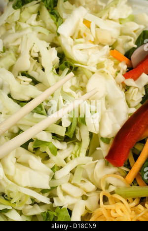 Chop sticks and raw thai food stir fry Stock Photo - Alamy