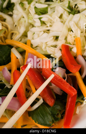 Chop sticks and raw thai food stir fry Stock Photo - Alamy