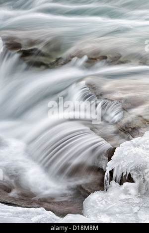 A frozen Athabasca Falls in Canada's Jasper National park Stock Photo ...