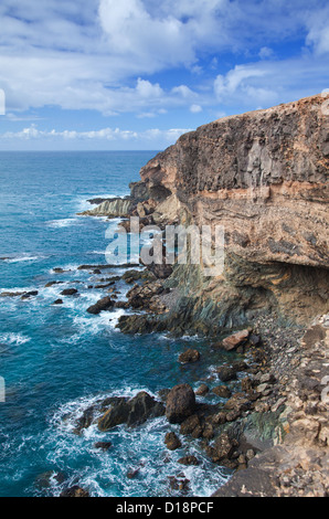 Waves foaming over sandstone rocks Stock Photo - Alamy