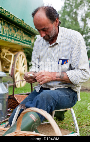 Romany gypsy making clothes pegs Stock Photo - Alamy