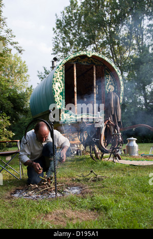 Romany gypsy tending camp fire Stock Photo - Alamy