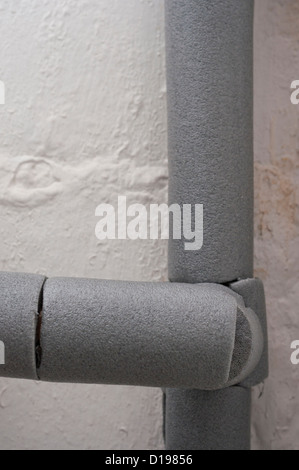 Lagging outdoor pipes with foam insulation Stock Photo - Alamy