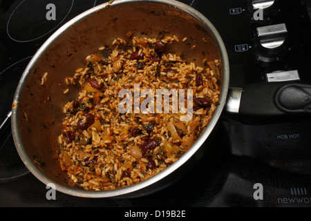 puerto rican rice cooking in a pan on hob Stock Photo - Alamy