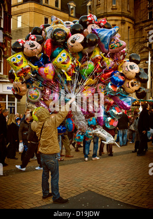 Balloon seller selling inflated Helium Balloons on the streets of ...