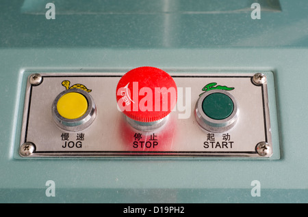 Industrial machine start stop and jog buttons in English and Chinese ...
