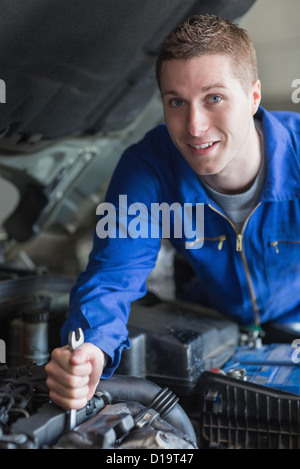 Man working on his car engine ca. 1970 Stock Photo - Alamy