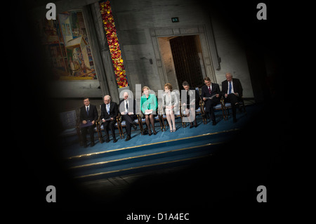 Nobel Peace prize winners sits along with members of the Norwegian ...