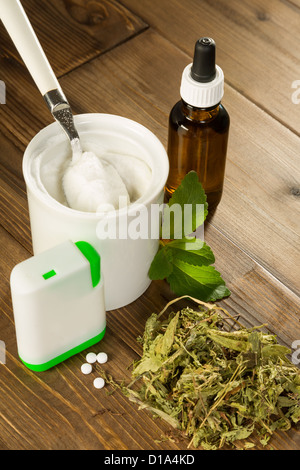 Stevia with sweetening tablets and bottle on wooden surface Stock Photo ...