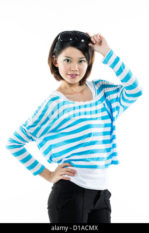 Young chinese woman wearing casual jacket standing over isolated white ...