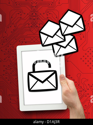 Hand holding tablet and sending email icons Stock Photo - Alamy