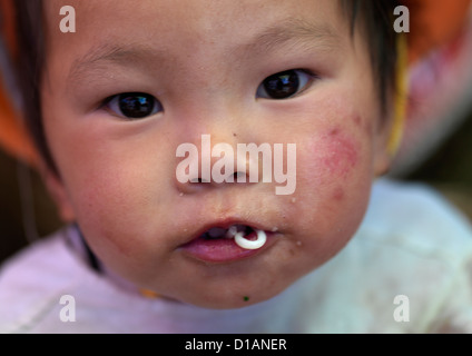 Chinese Baby Eating Noodles, Lijiang, Yunnan Province, China Stock ...