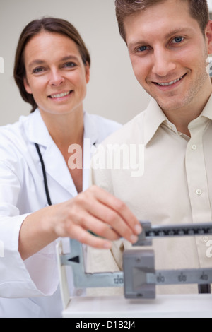 Doctor Measuring Patients Weight Stock Photo - Alamy