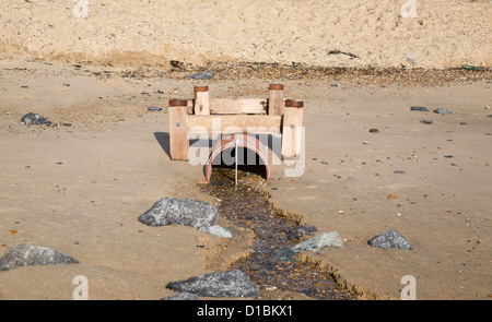 Beach drain pipe Stock Photo - Alamy