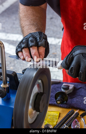 Stropping wheel for final polishing of sharpened knife Stock Photo - Alamy