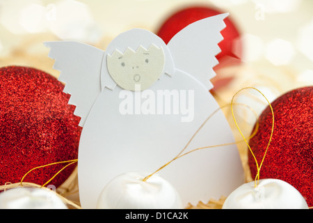 Christmas card with paper angel, balls and spruce twig Stock Photo - Alamy