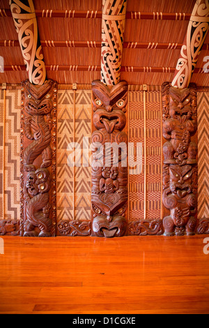 Carved Traditional Maori Figure, called pou-toko-manawa, supporting the ...