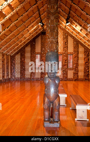 Carved Traditional Maori Figure, called Poupou, supporting the overhead ...