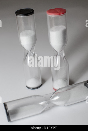 hourglass - passing time, three glass hourglasses in metal frames ...