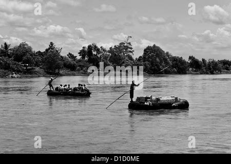 A makeshift inner tube raft, carrying immigrants from Central America ...