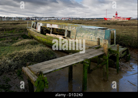 The wreck of an old wooden barge abandoned in the River Medway Stock ...