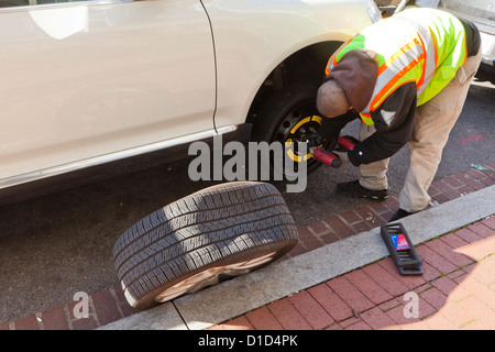 Replacing a Flat Tire Mechanic Changing Car Tire on Roadside for Safety ...