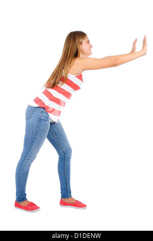 Woman pushing an imaginary object isolated over a white background ...