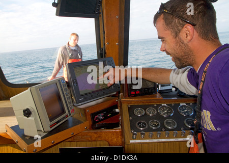 Skipper on a fishing boat in the Pacific Ocean off the coast of Stock ...