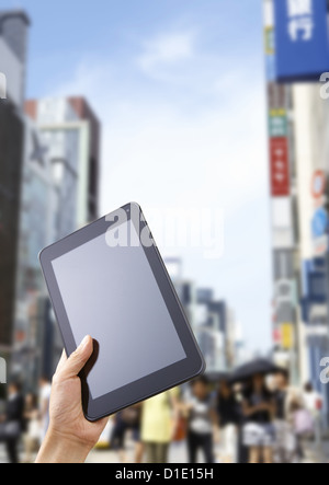 Cityscape of Ginza and a tablet PC Stock Photo - Alamy