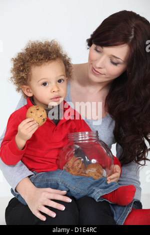 Toddler eating a chocolate chip cookie Stock Photo - Alamy