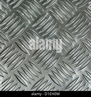 Close up of checker plate metal spiral steps in outdoor staircase ...