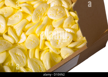 A cardboard box with yellow packing styrofoam peanuts, isolated on ...