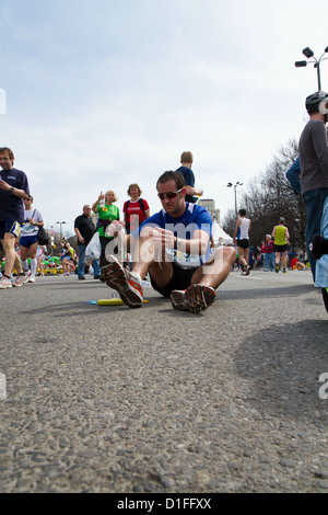 Runners fastening their Shoes just after Finish of the Berlin Half ...