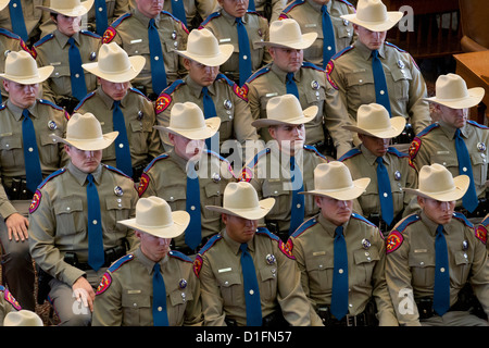Members of the graduating class of Texas state troopers sit during ...