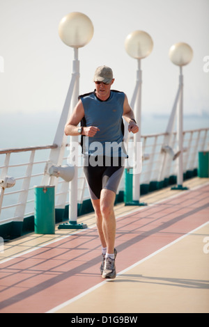 Man running on Cruise Ship deck Stock Photo - Alamy