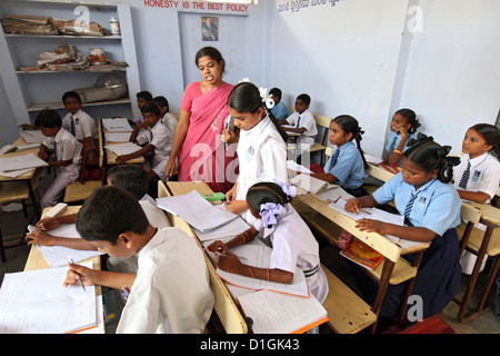 Vijayawada, India, a school class in the classroom with the teacher ...