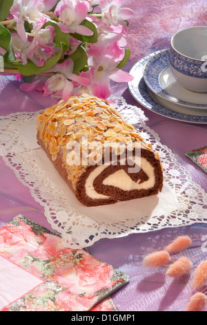 A vertical shot of chocolate cakes in grayscale served on a large ...