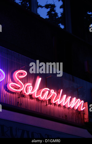 red pink neon solarium shop sign notice Stock Photo - Alamy