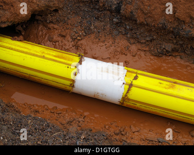 Newly laid High pressure yellow polythene gas main pipe in trench ...