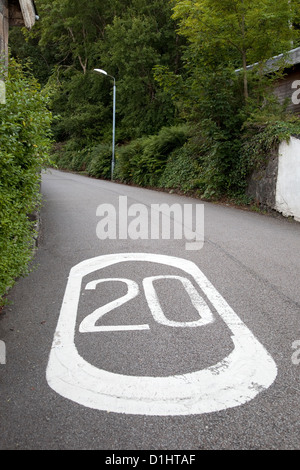Twenty mile per hour speed limit sign reminder on a lampost in a city ...
